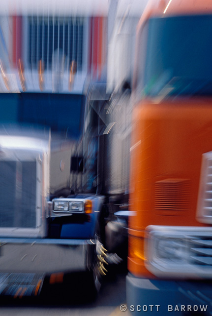 Trucks passing on highway. - The Scott Barrow Gallery and Image Archive
